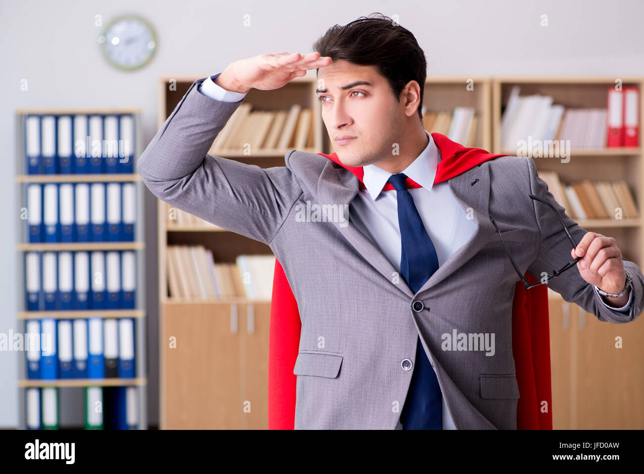 Superhero businessman working in the office Stock Photo - Alamy