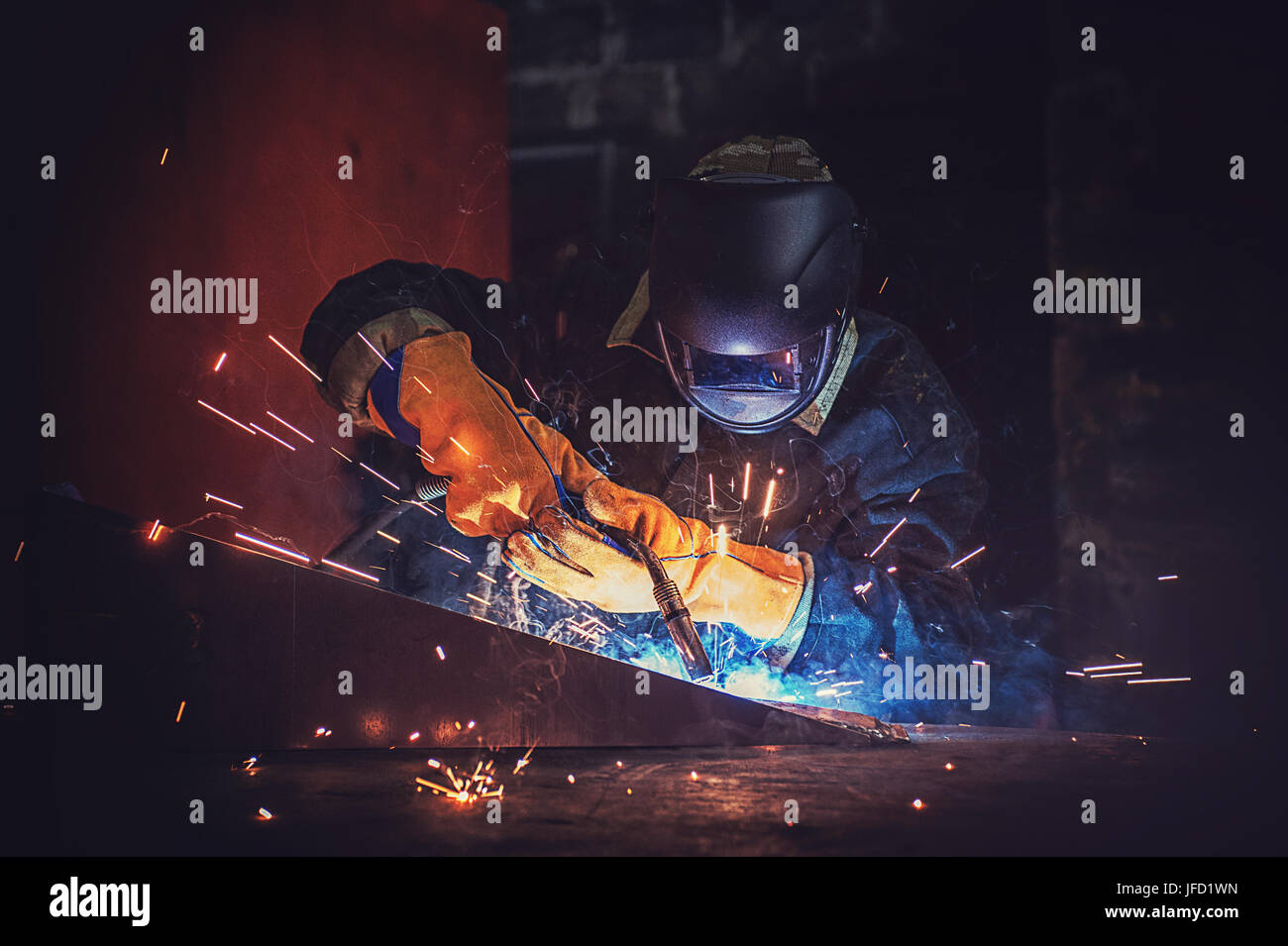 worker welding metal Stock Photo - Alamy