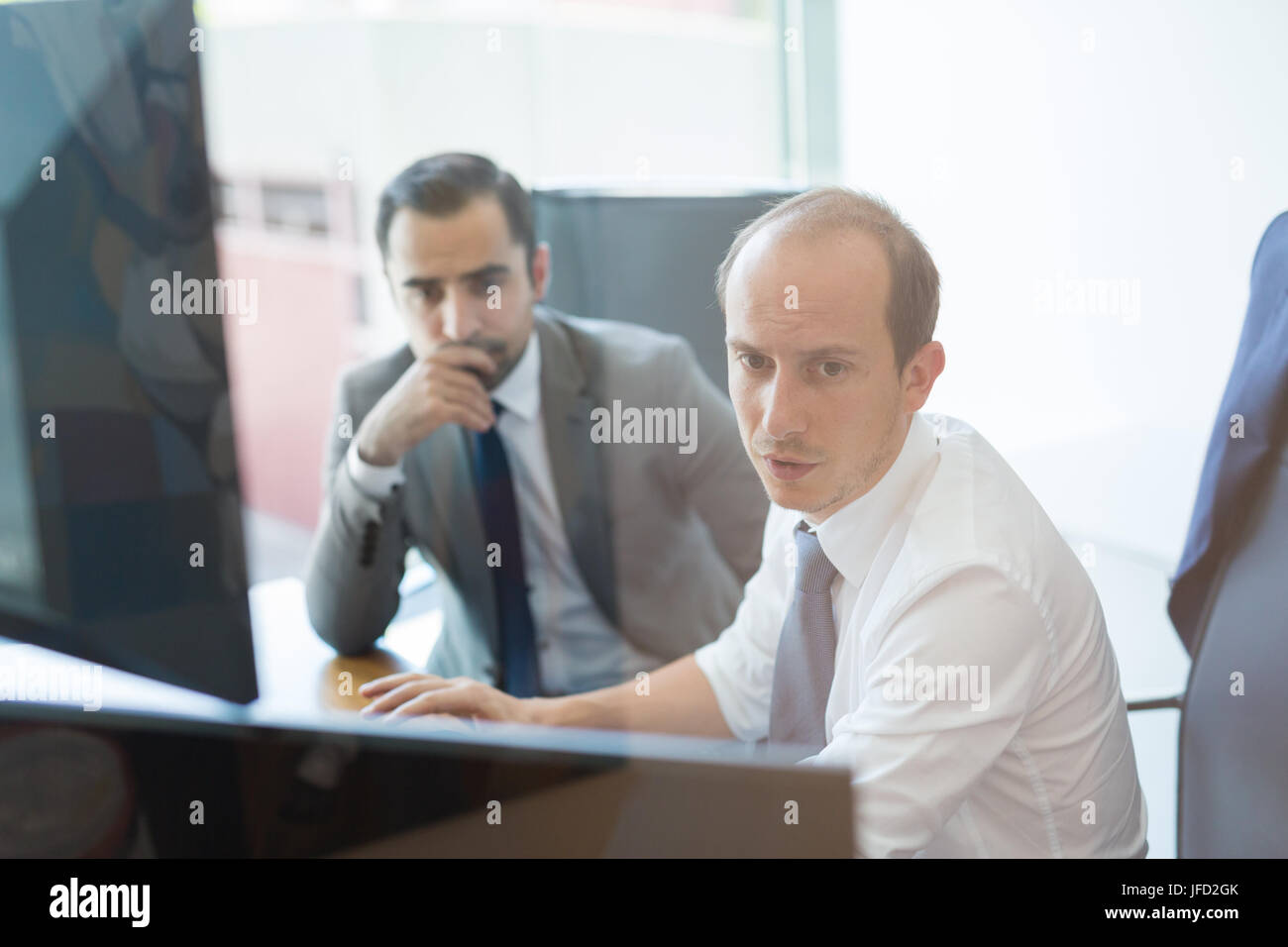 Man at two computer screens hi-res stock photography and images - Alamy