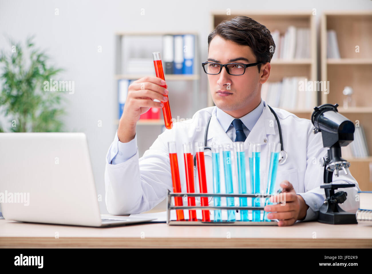 Man doctor working in the lab Stock Photo - Alamy