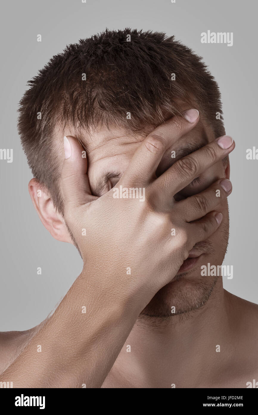 Man doing facepalm or cover his eyes and face with palm Stock Photo - Alamy