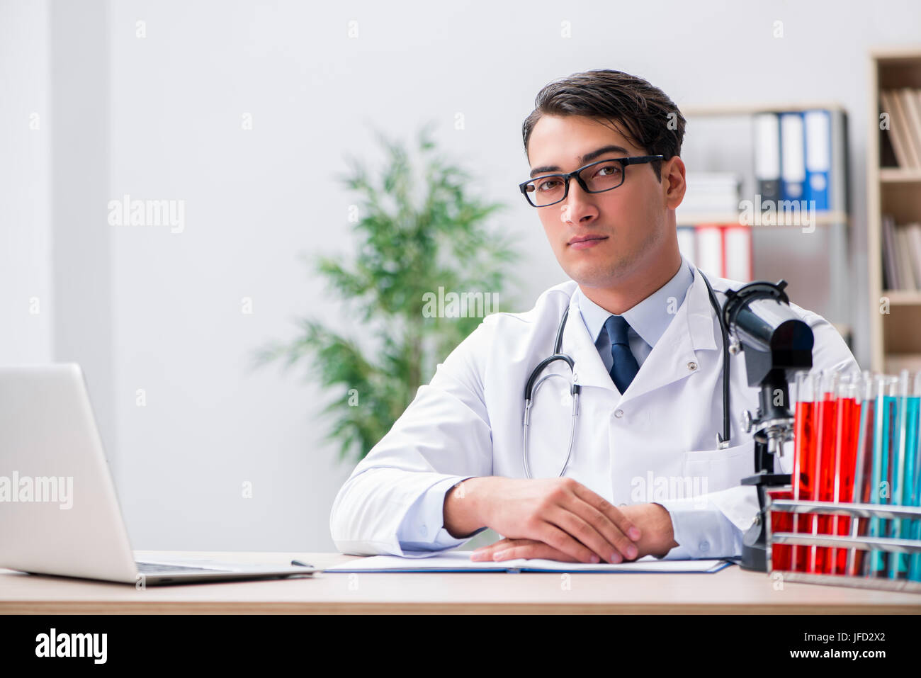 Man doctor working in the lab Stock Photo - Alamy