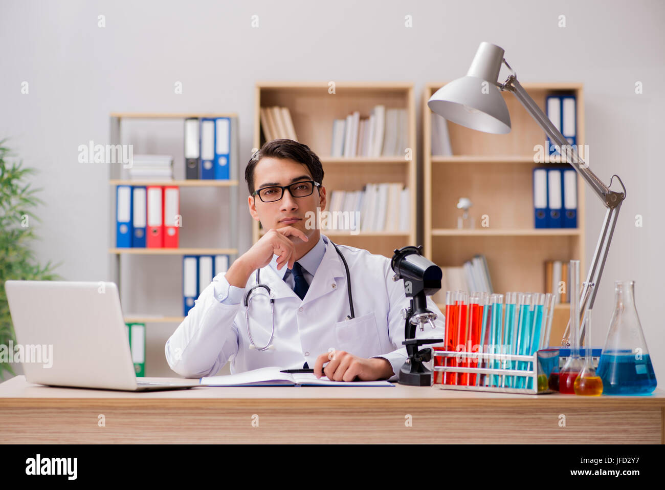 Man doctor working in the lab Stock Photo - Alamy