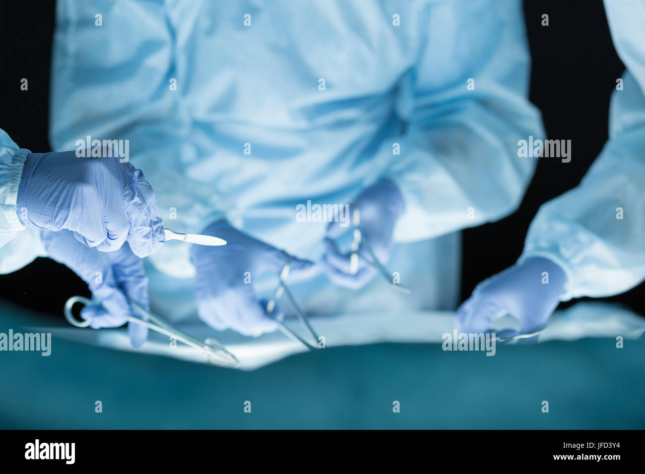 Hands medical team performing surgical hi-res stock photography and ...