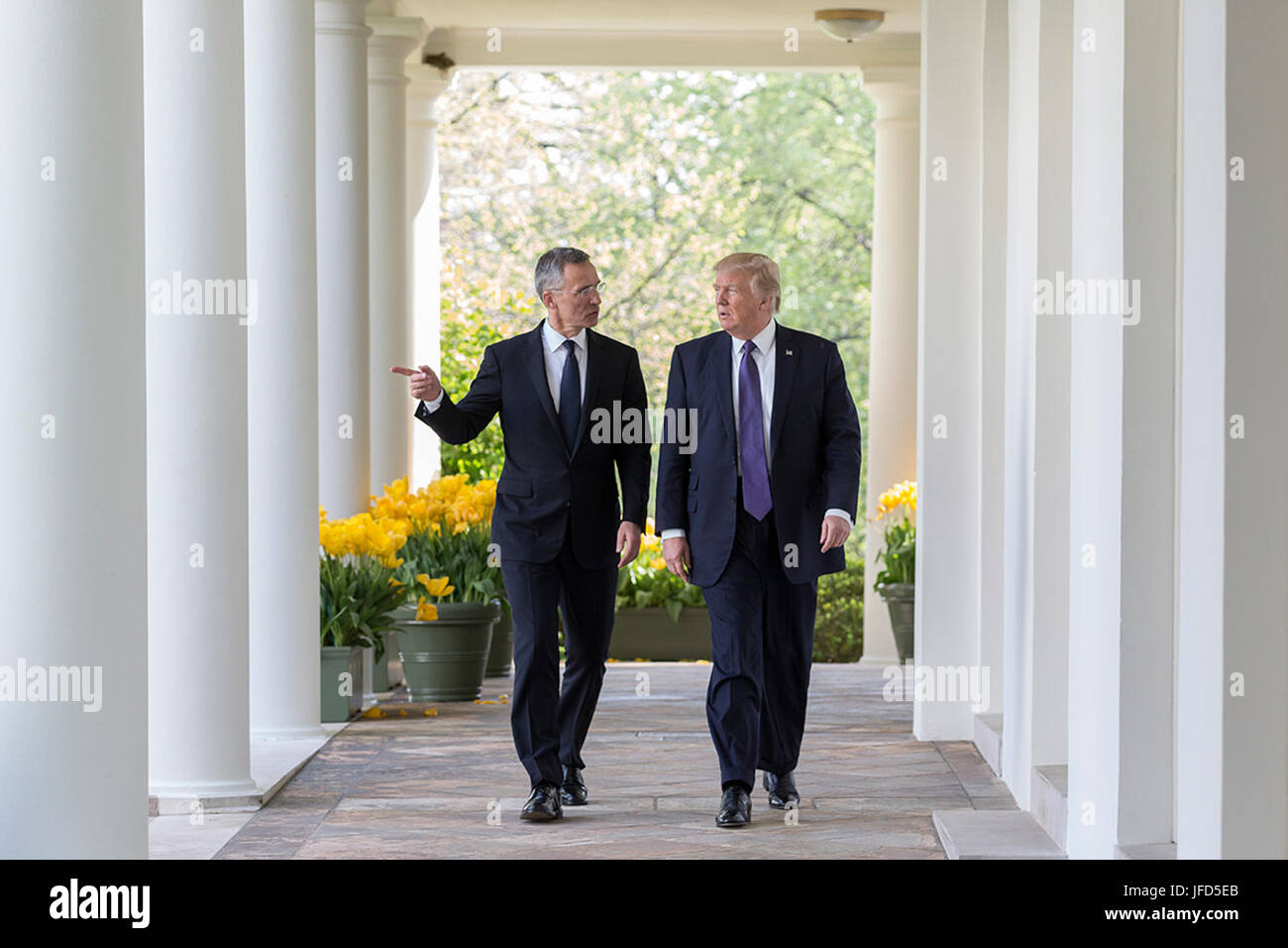 President Donald Trump and NATO Secretary General Jens Stoltenberg walk ...