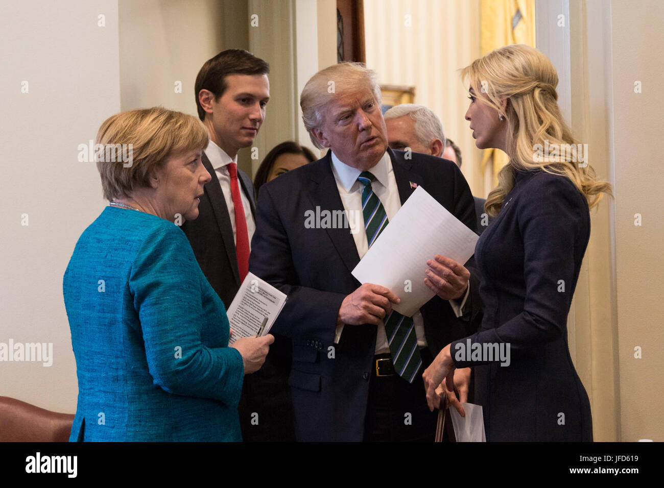 President Donald Trump talks with German Chancellor Angela Merkel ...