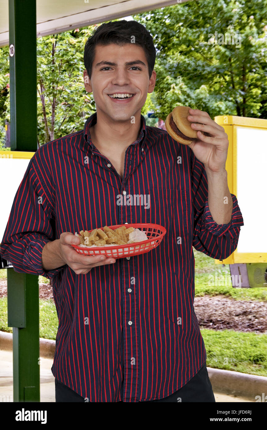 Man eating hamburger Stock Photo - Alamy