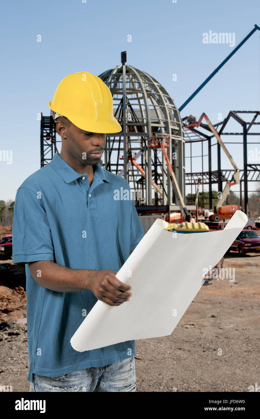 Black Construction Worker with Blueprints Stock Photo - Alamy
