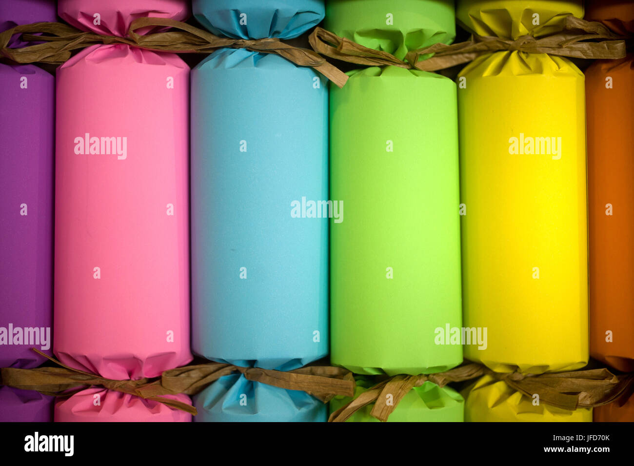 Brightly coloured Christmas crackers Stock Photo - Alamy