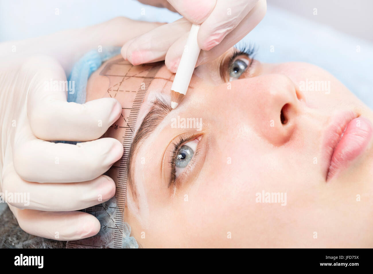 Microblading eyebrows workflow in a beauty salon Stock Photo - Alamy