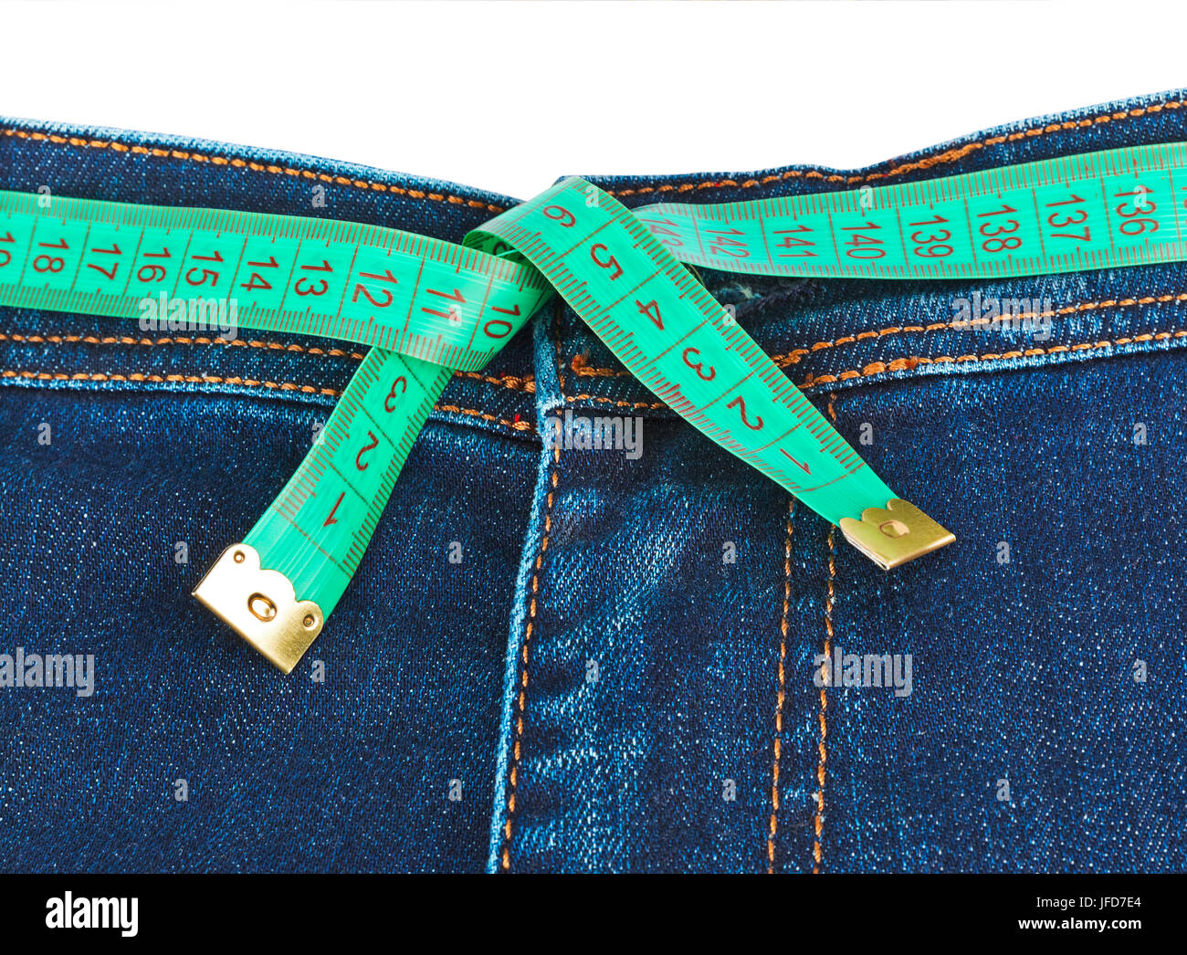 Jeans and measuring tape - slimming concept Stock Photo - Alamy