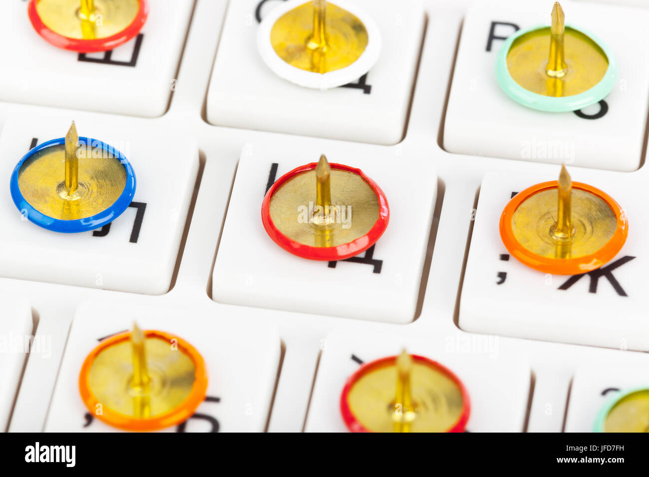 Pins on computer keyboard Stock Photo - Alamy