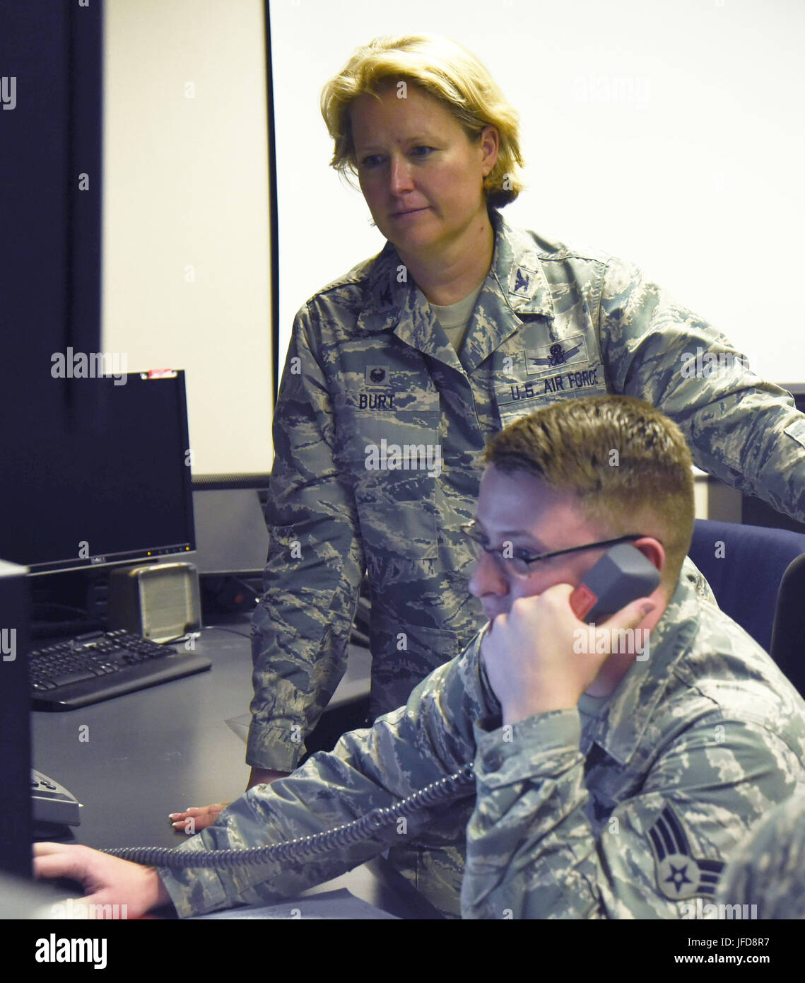 Col. DeAnna Burt, 50th Space Wing Commander, gives Senior Airman ...