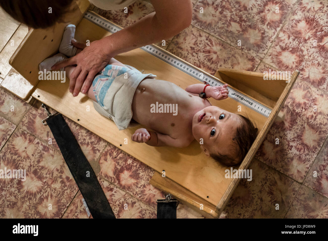 U.S. Army LTC Rhonda Dyer performs anthropometric measurements on a ...