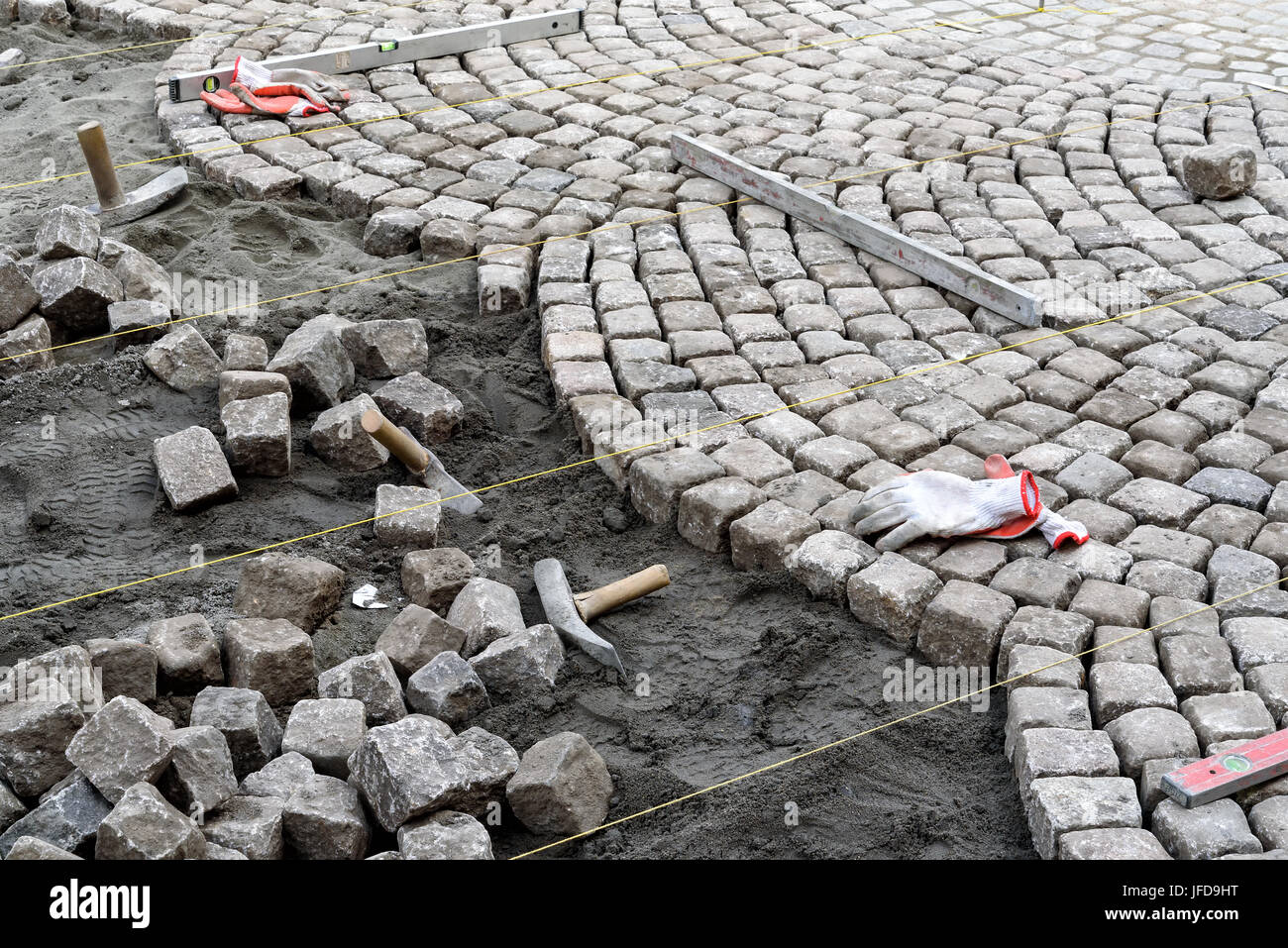 Pavement worker cobblestones hi-res stock photography and images - Alamy