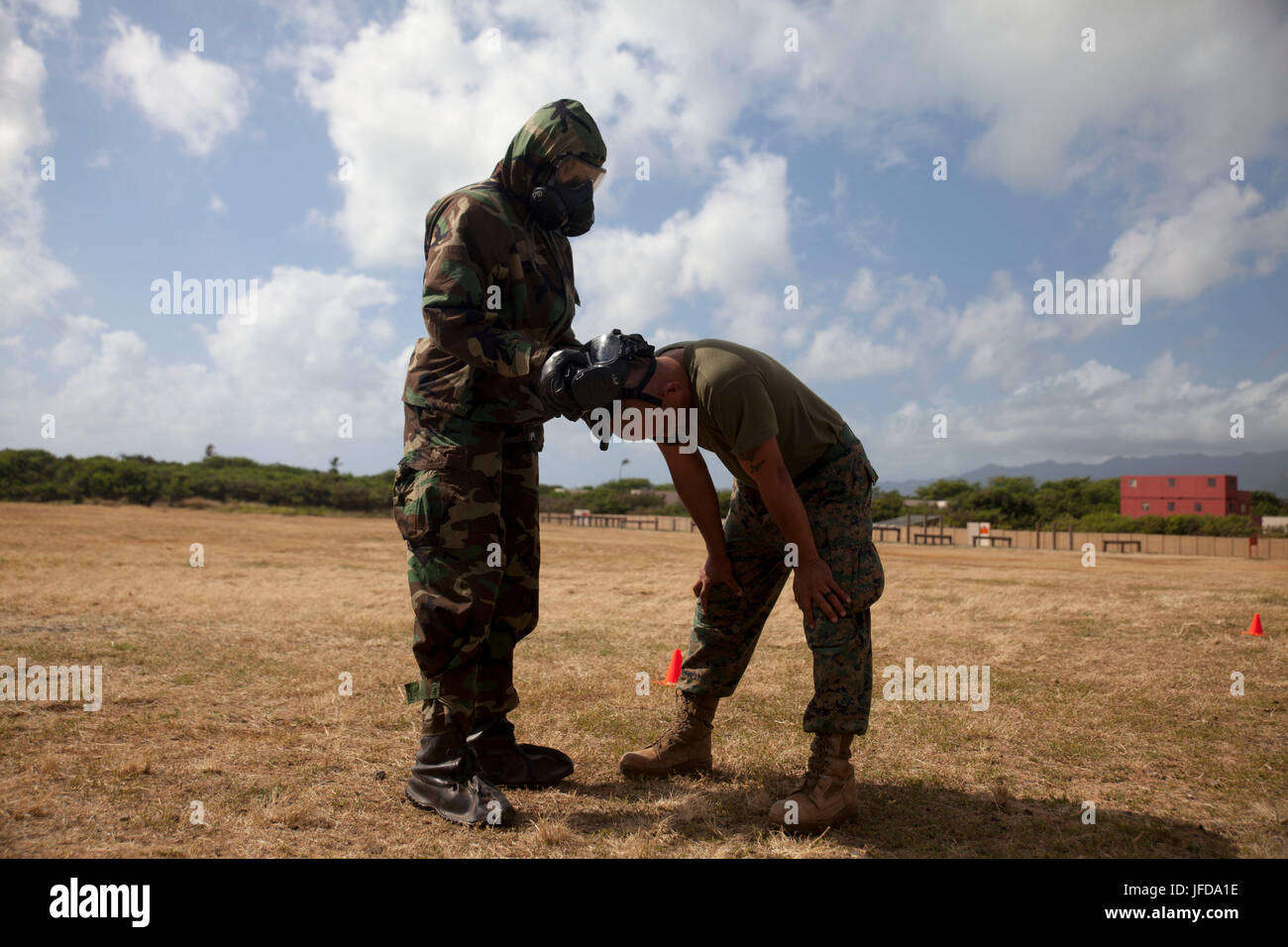 A Marine recovers after exiting the gas chamber aboard Marine Corps ...