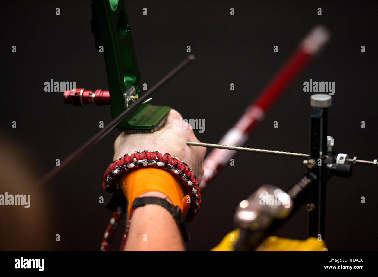 A metal rod serves as a guide to help an visually impaired archer find ...