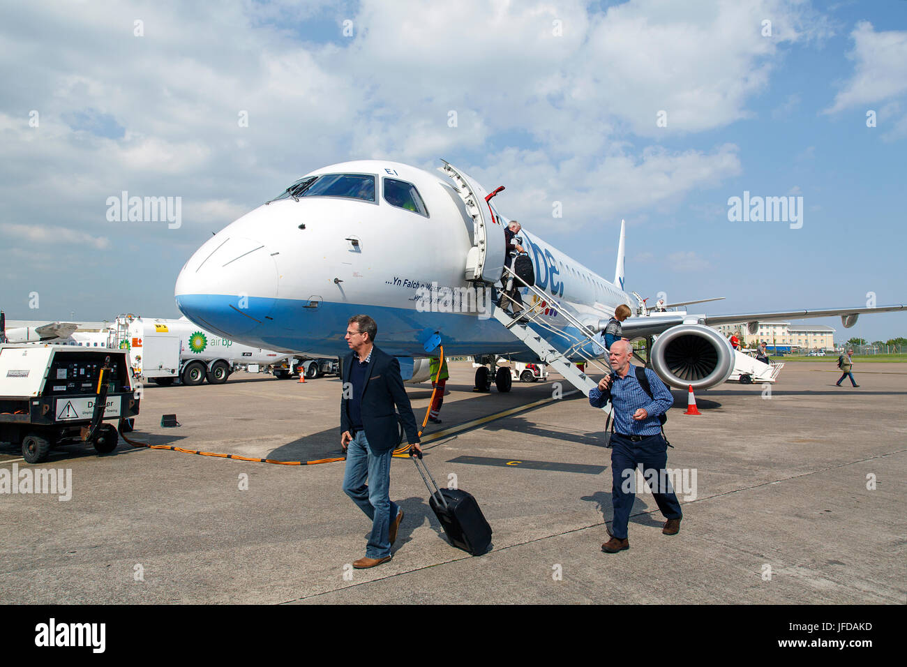 Passengers Disembark from an Airplane Stock Photo - Alamy