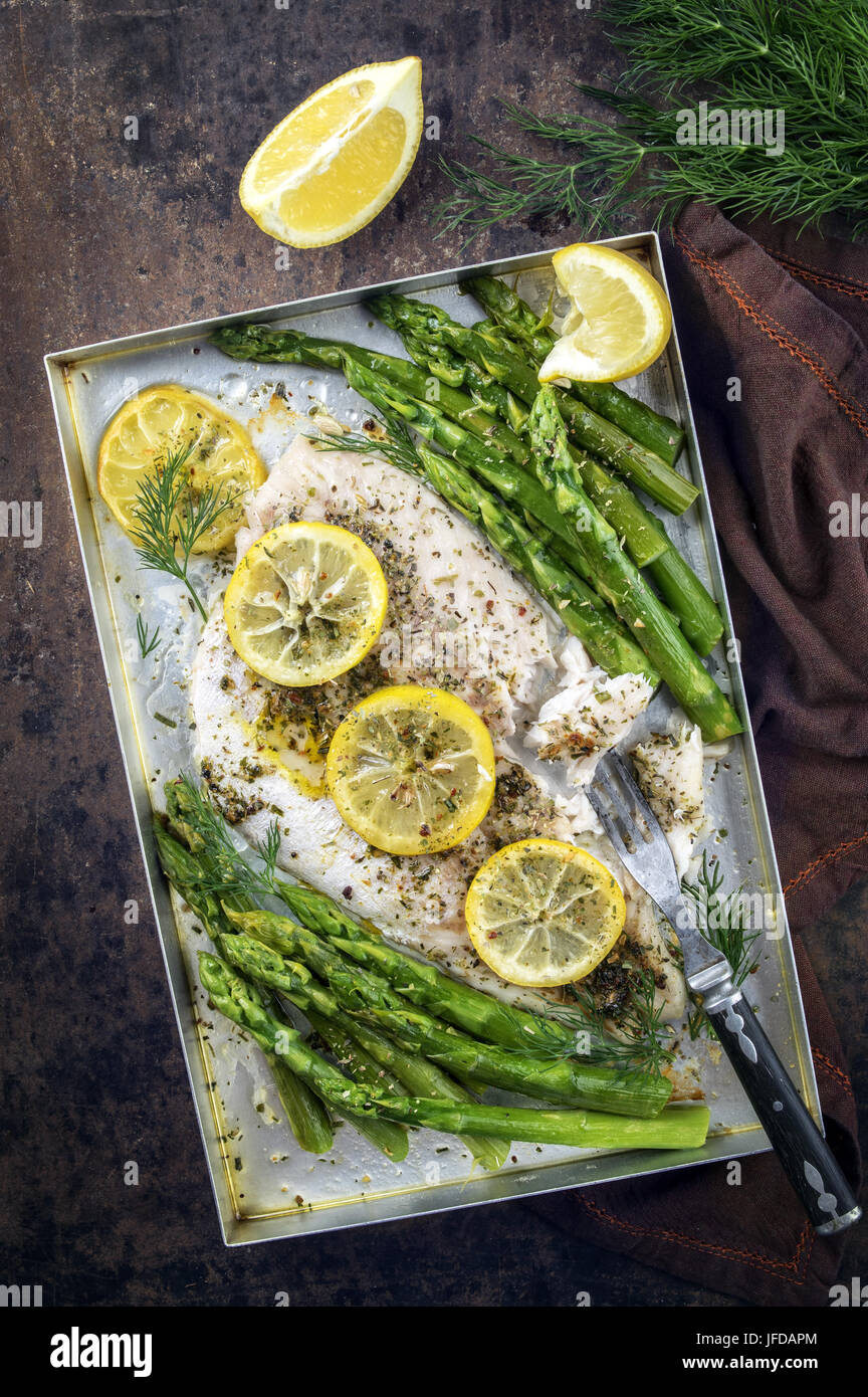 Coalfish Filet with Green Asparagus Stock Photo - Alamy