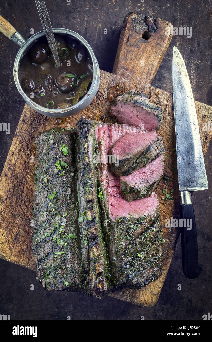 Barbecue Saddle of Venison on Cutting Board Stock Photo - Alamy