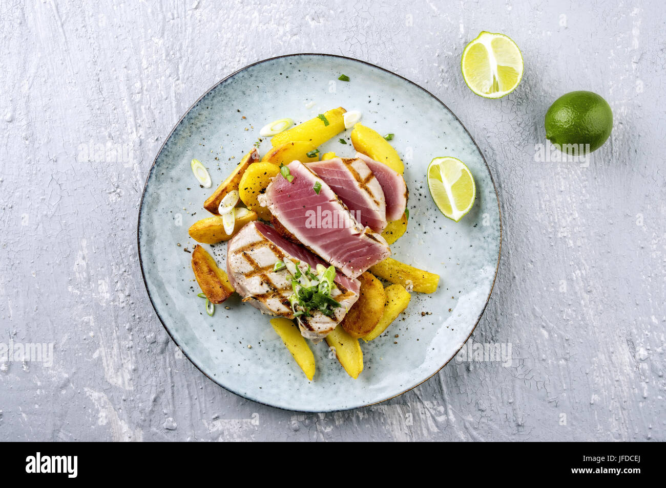 Tuna Steak with Fries Stock Photo - Alamy