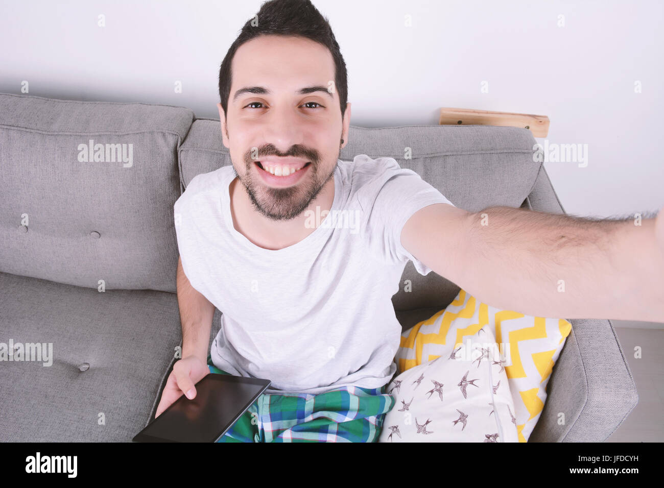 Attractive young man taking selfie. Indoors Stock Photo - Alamy Attractive young man taking selfie. Indoors Stock Photo - Alamy