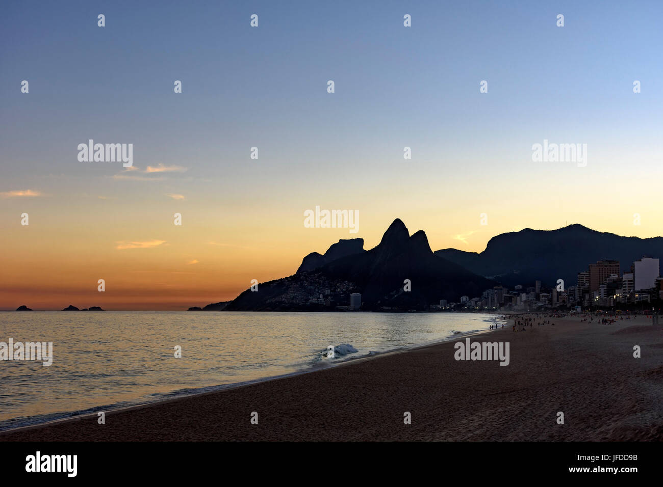 Summer sunset at Ipanema beach in Rio de Janeiro with Two Brothers hill ...