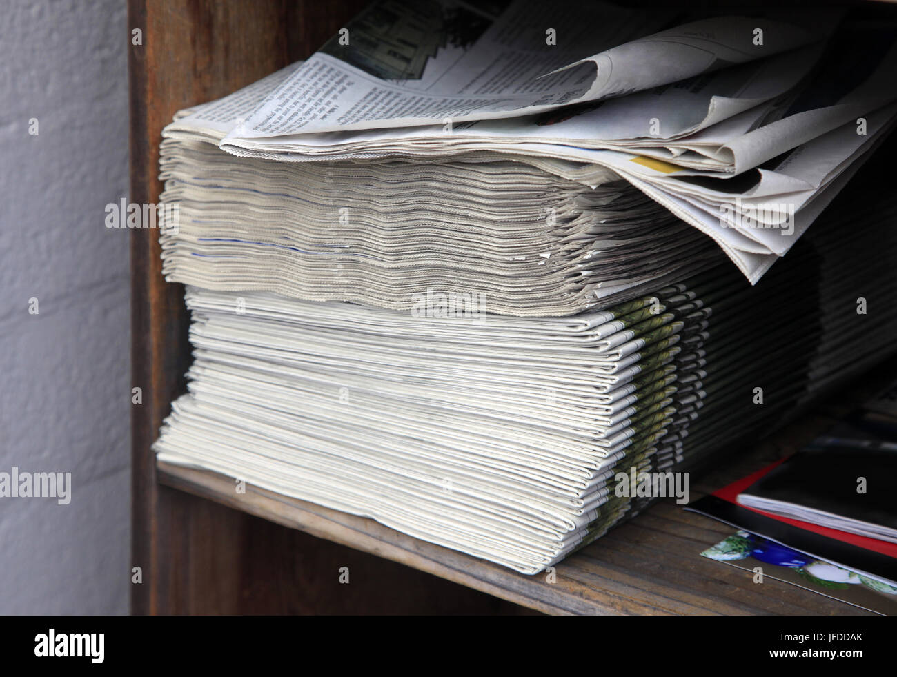 Big pile of newspapers close up Stock Photo - Alamy