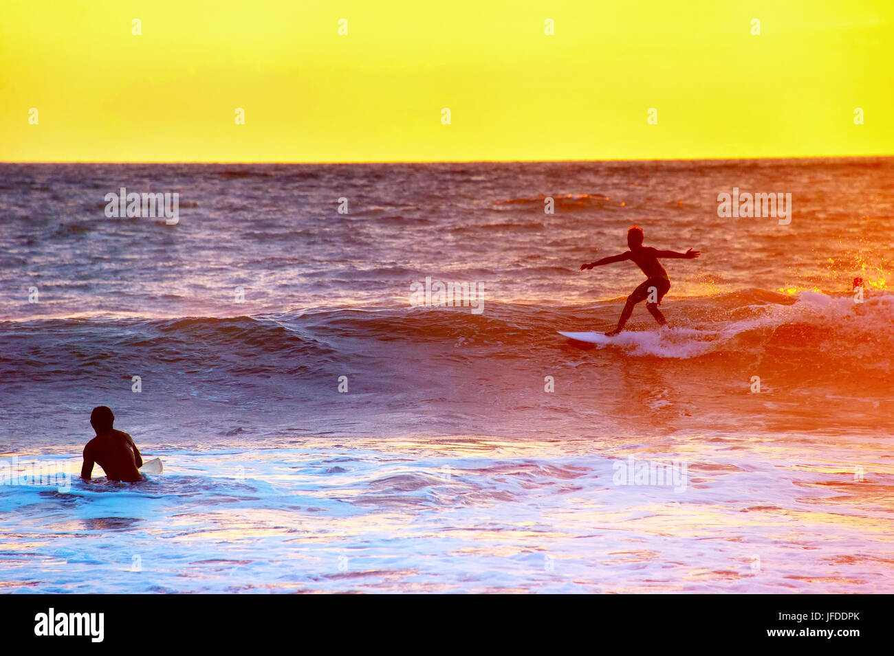 Colorful Bali surfing scene Stock Photo - Alamy