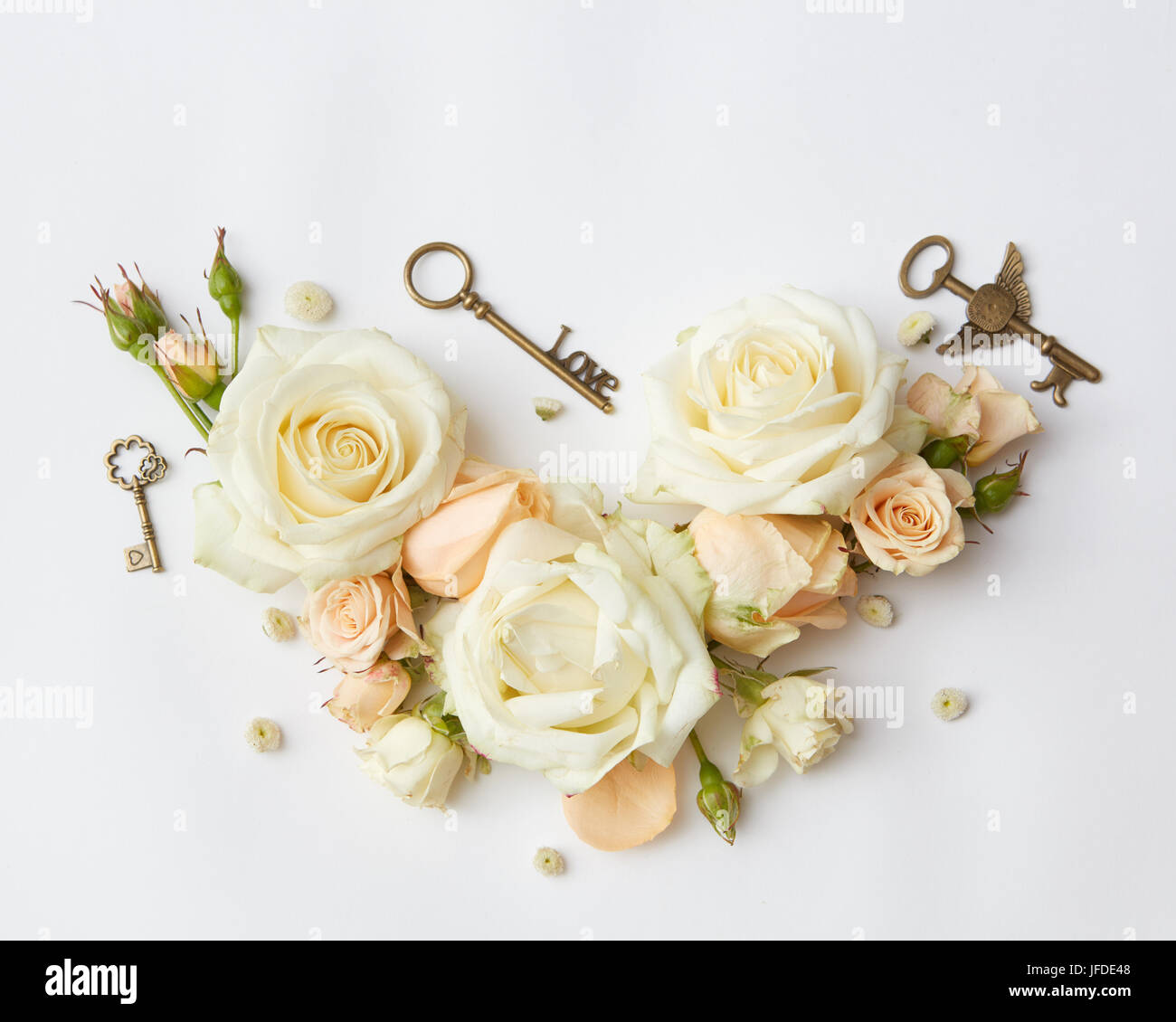 Red roses with key Stock Photo - Alamy