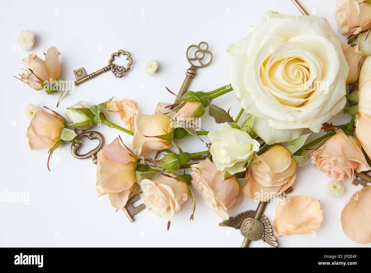 Red roses with key Stock Photo - Alamy