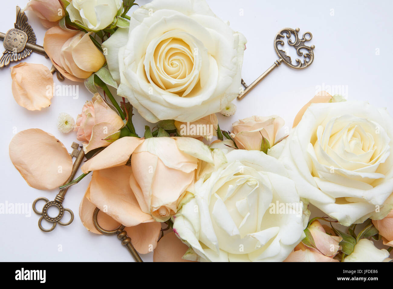 Red roses with key Stock Photo - Alamy