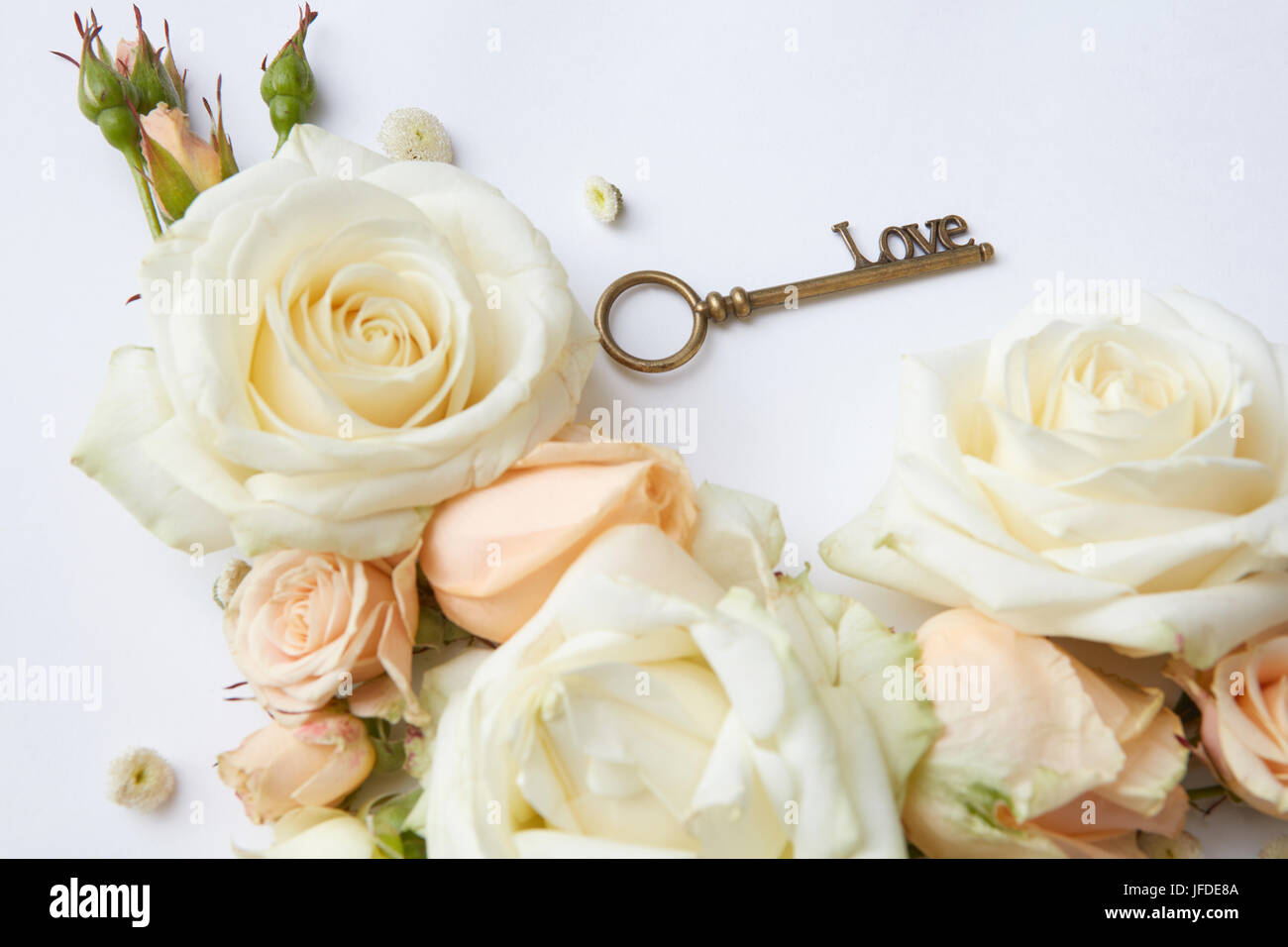 Red roses with key Stock Photo - Alamy