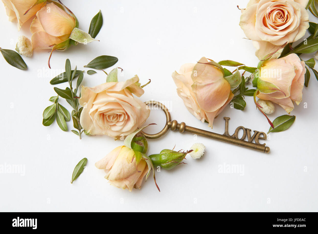 Key with rose petals Stock Photo - Alamy
