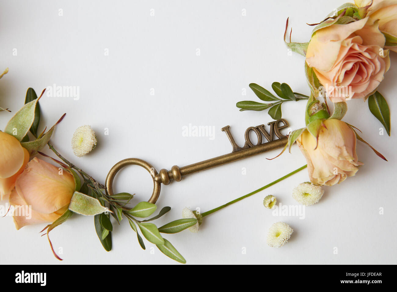 Key with rose petals Stock Photo - Alamy