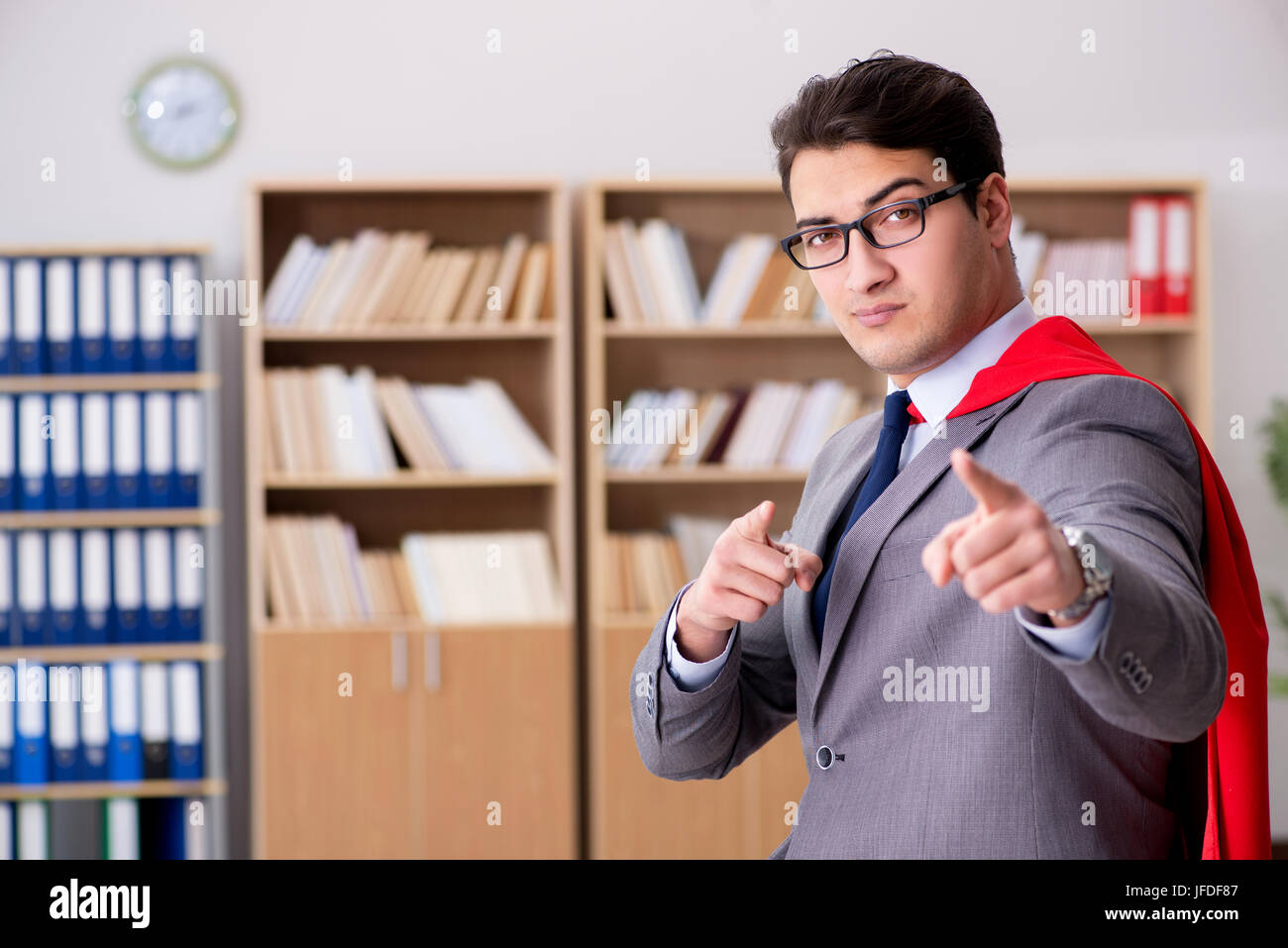 Superhero businessman working in the office Stock Photo - Alamy