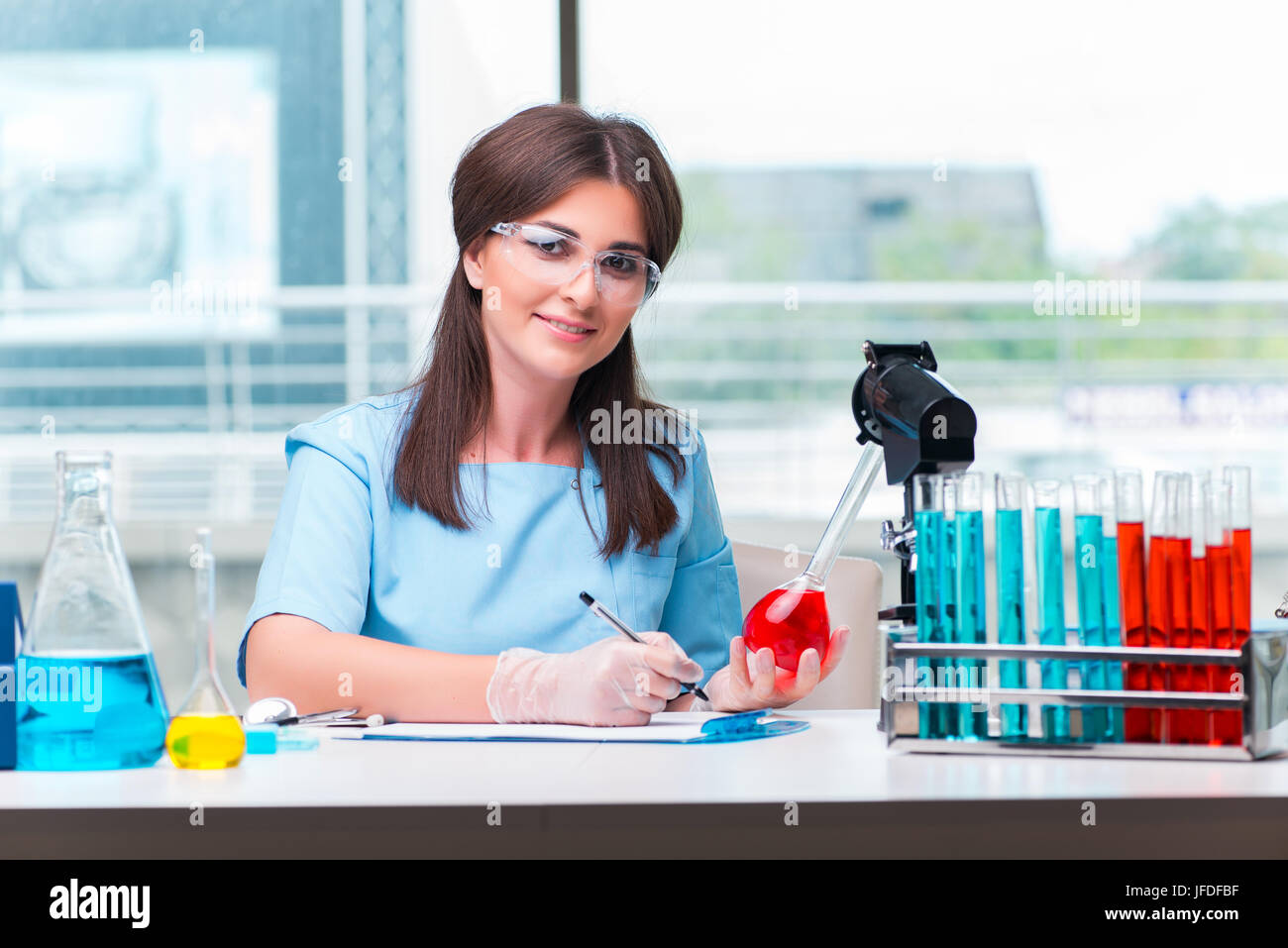 Young female doctor working in the lab Stock Photo - Alamy
