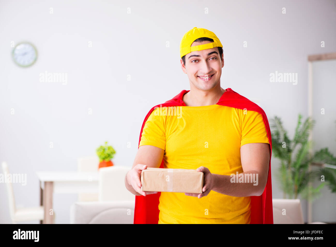 Superhero delivery guy with box Stock Photo - Alamy