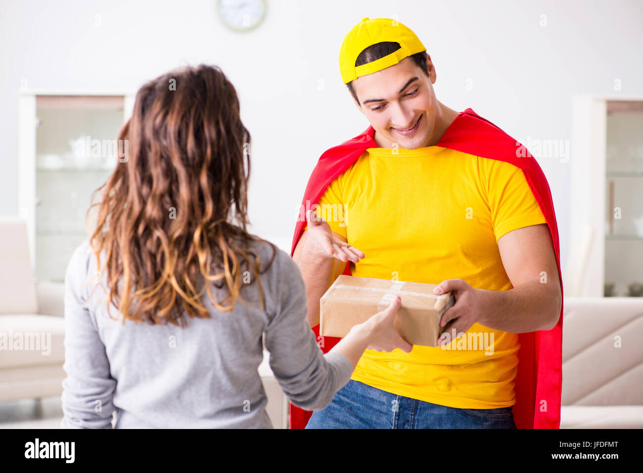 Superhero delivery guy with box Stock Photo - Alamy