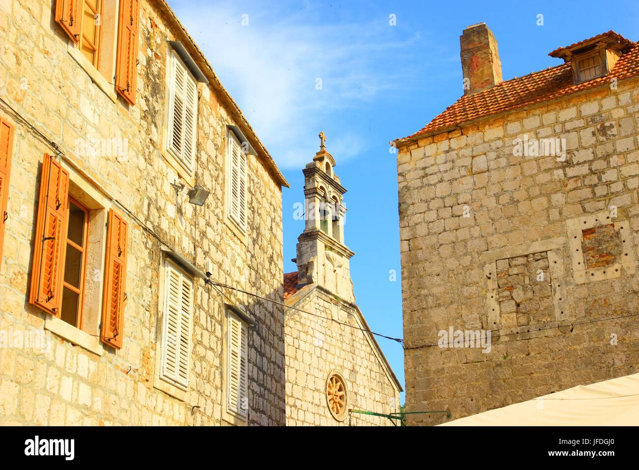 Street view on old stone houses and church in Stari Grad, Island Hvar ...