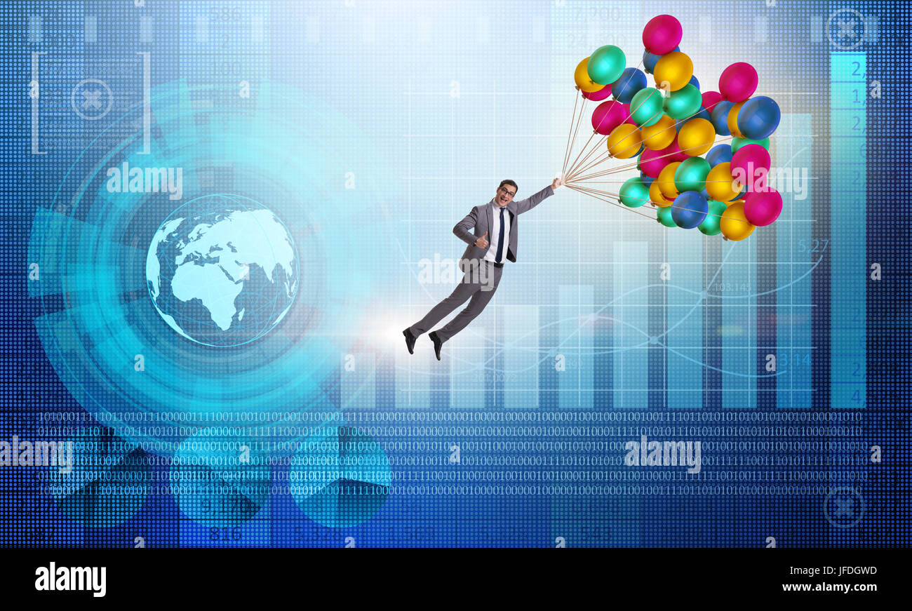 Businessman flying on balloons over graph Stock Photo - Alamy