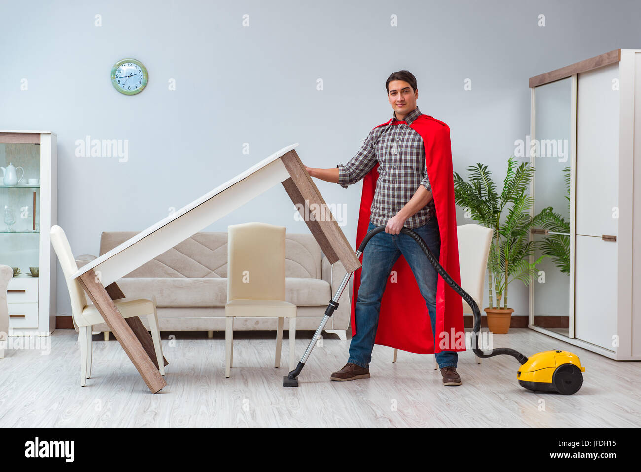 Super hero cleaner working at home Stock Photo - Alamy