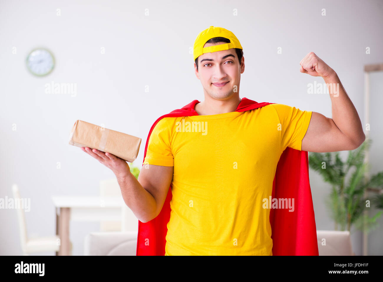 Superhero delivery guy with box Stock Photo - Alamy