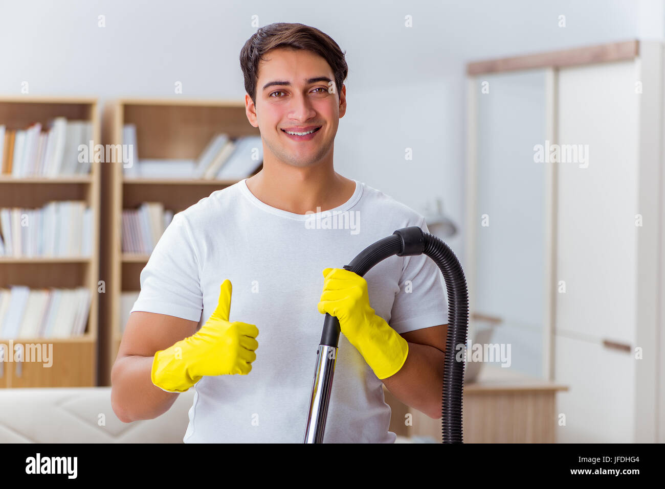 Man husband cleaning the house helping wife Stock Photo - Alamy