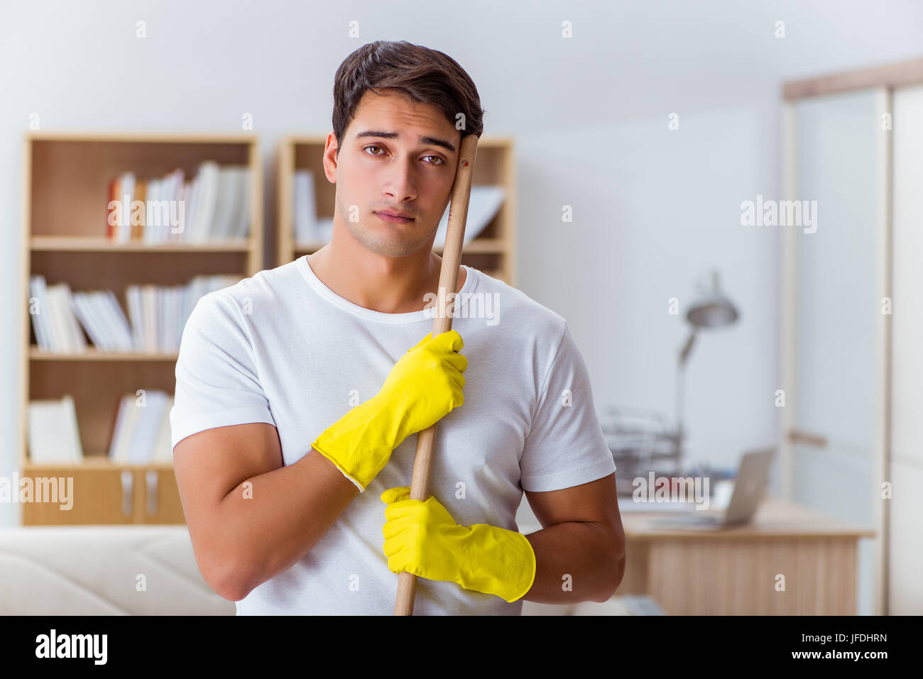 Man husband cleaning the house helping wife Stock Photo - Alamy