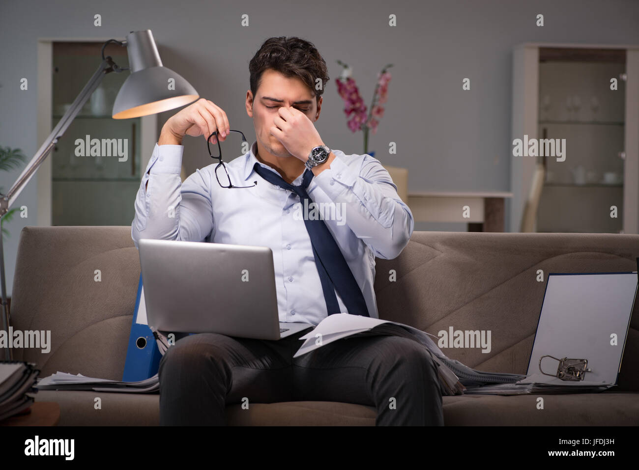 Businessman workaholic working late at home Stock Photo - Alamy