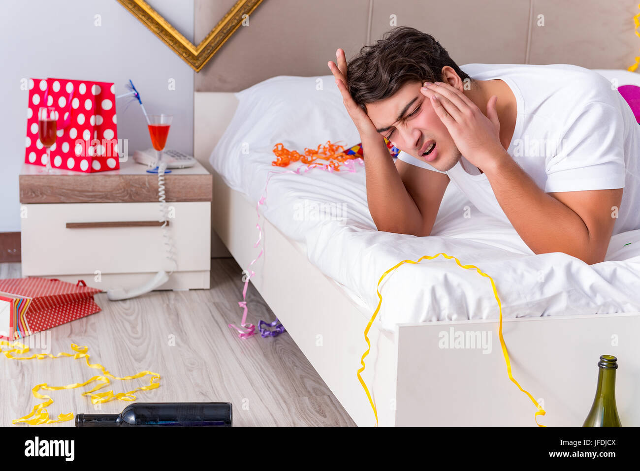 Man after heavy christmas partying at home Stock Photo - Alamy