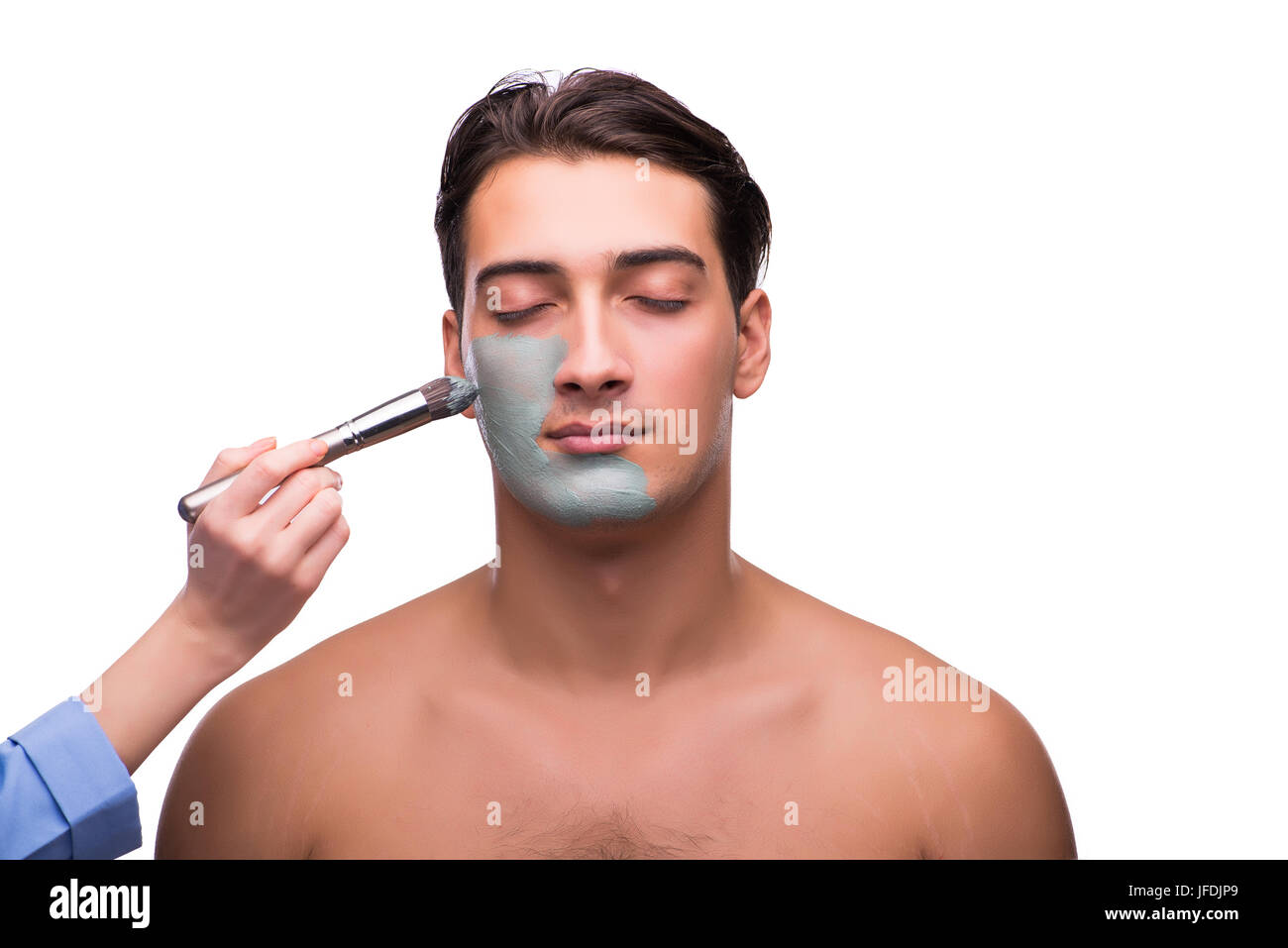 Man with face mask being applied on white Stock Photo - Alamy Man with face mask being applied on white Stock Photo - Alamy