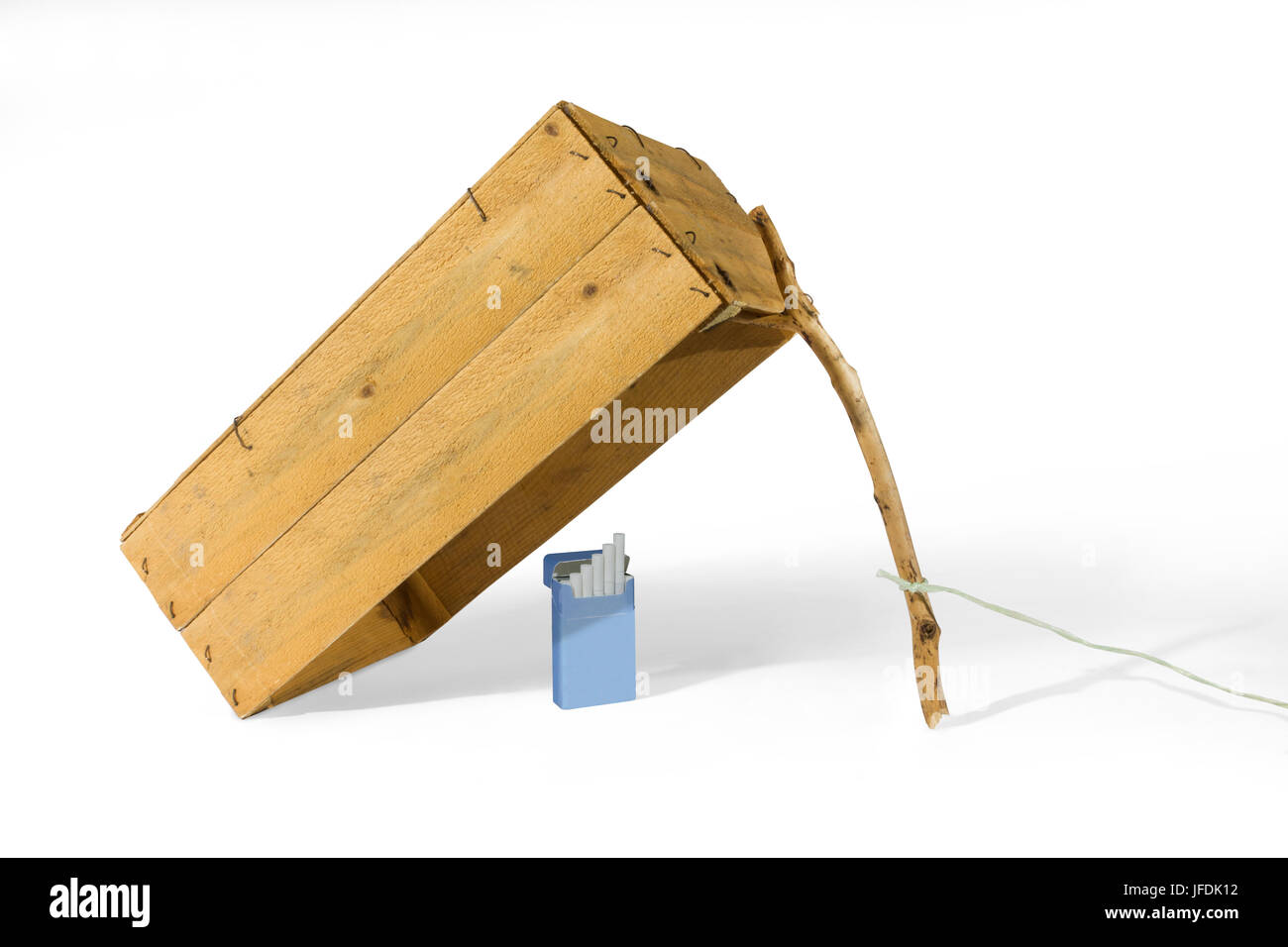 Cigarette pack under box trap Stock Photo - Alamy