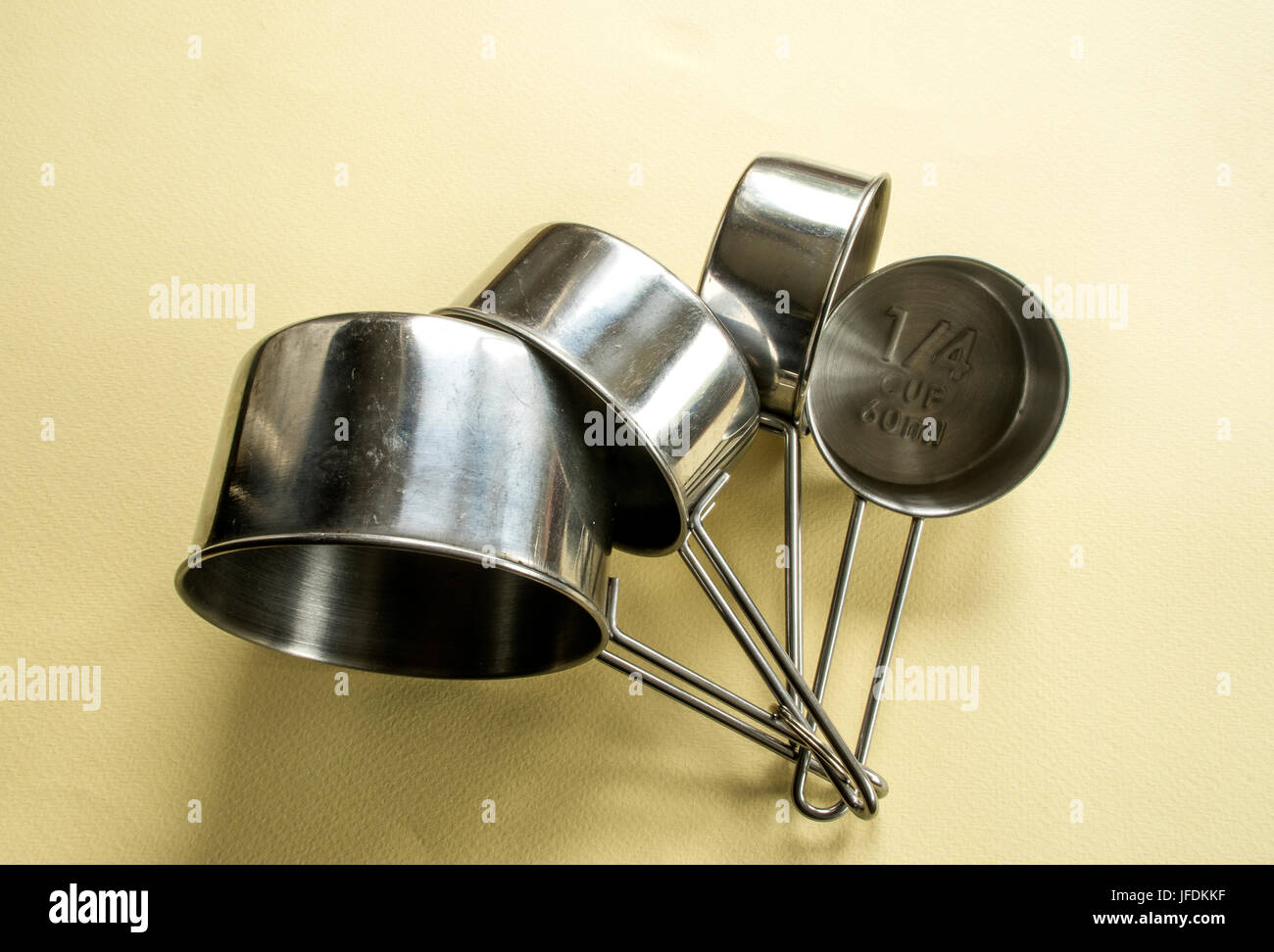 A set of cups used for getting the correct volume of ingredients for ...